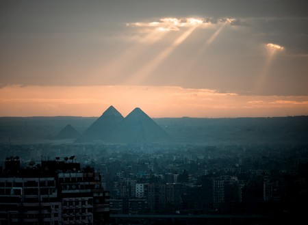 Sun rays shining on Giza Pyramids • The Middle Frame • Arab Stock ...