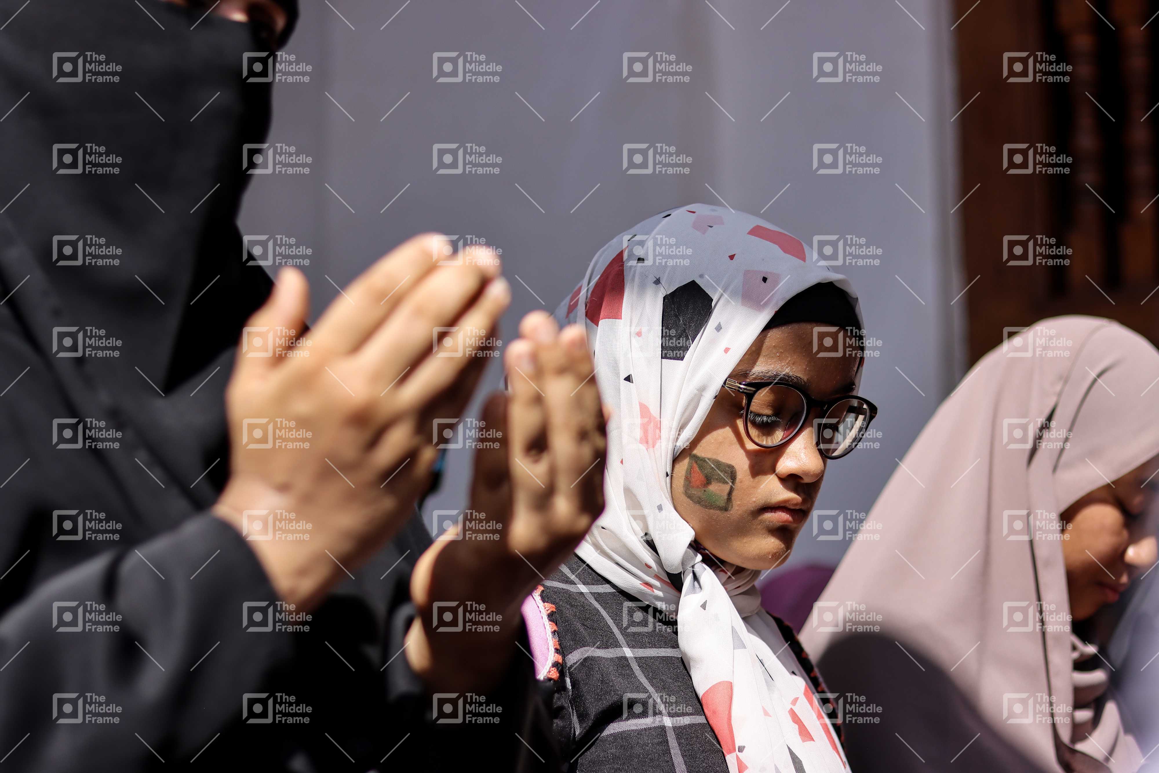 Praying for Palestine • The Middle Frame • Arab Stock Photos and Images